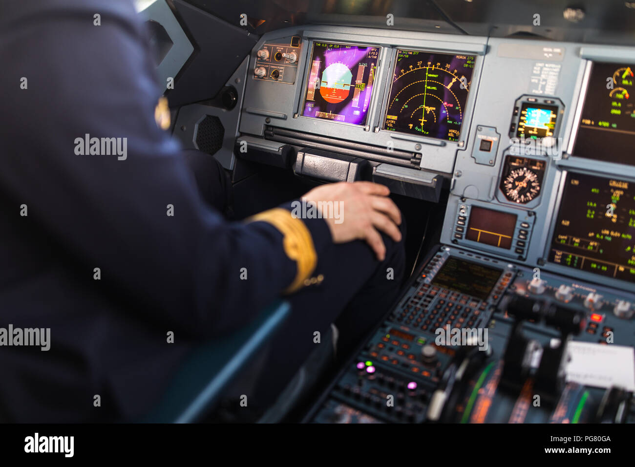 Pilot's hand accelerating on the throttle in a commercial airliner ...