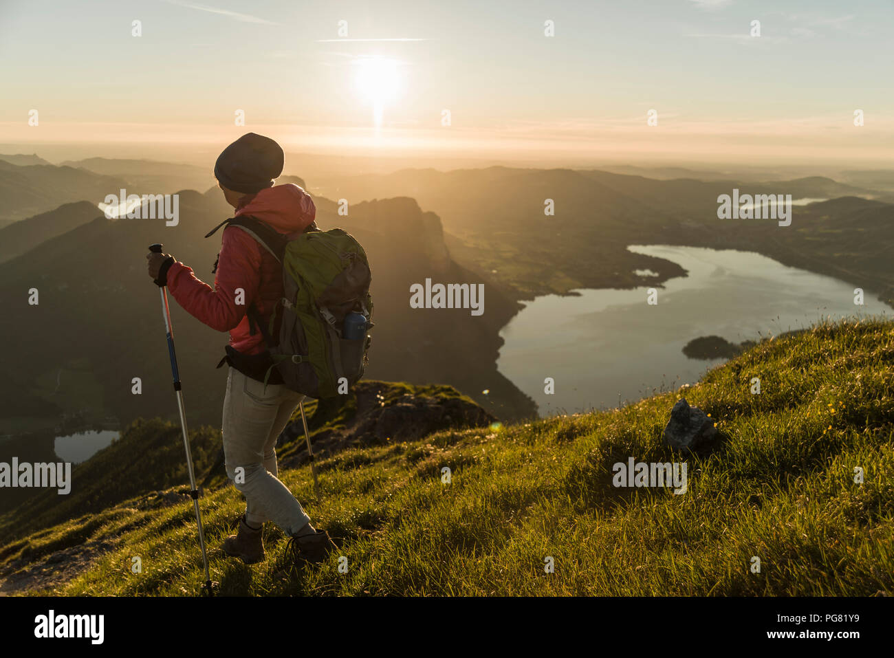 Woman hiking alone in tha mountains hi-res stock photography and images ...