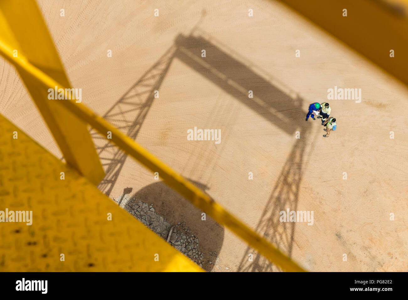 Construction workers on site talking from above Stock Photo - Alamy
