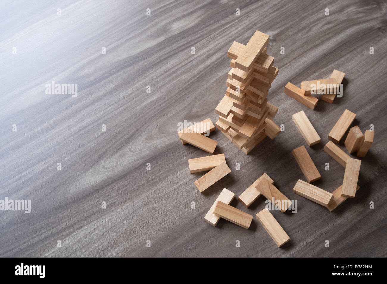 Wooden building blocks tower on wooden background top view with copy ...