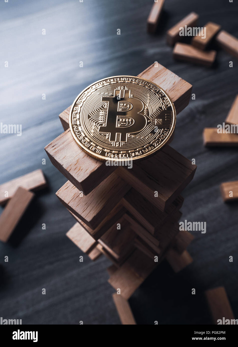 Bitcoin on the Wooden building blocks tower. Concept for bitcoin risk ...