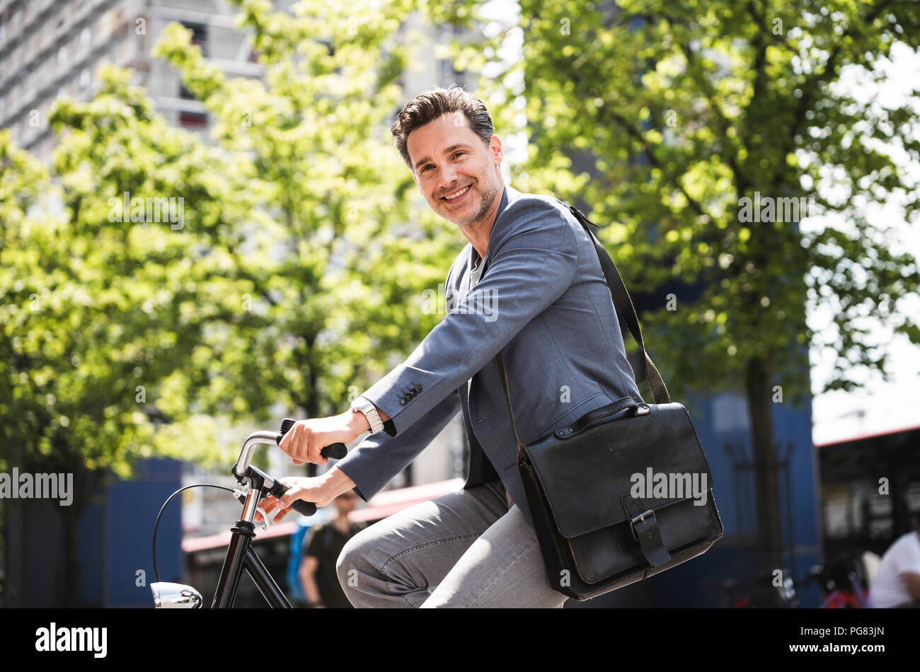 Man riding bike city hi-res stock photography and images - Alamy