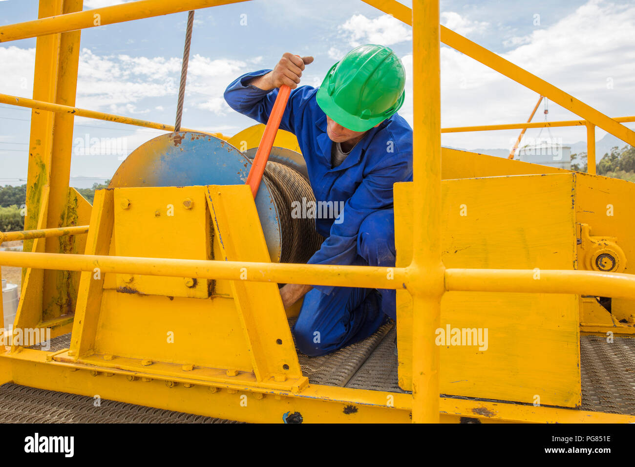 Construction worker working on crane Stock Photo - Alamy