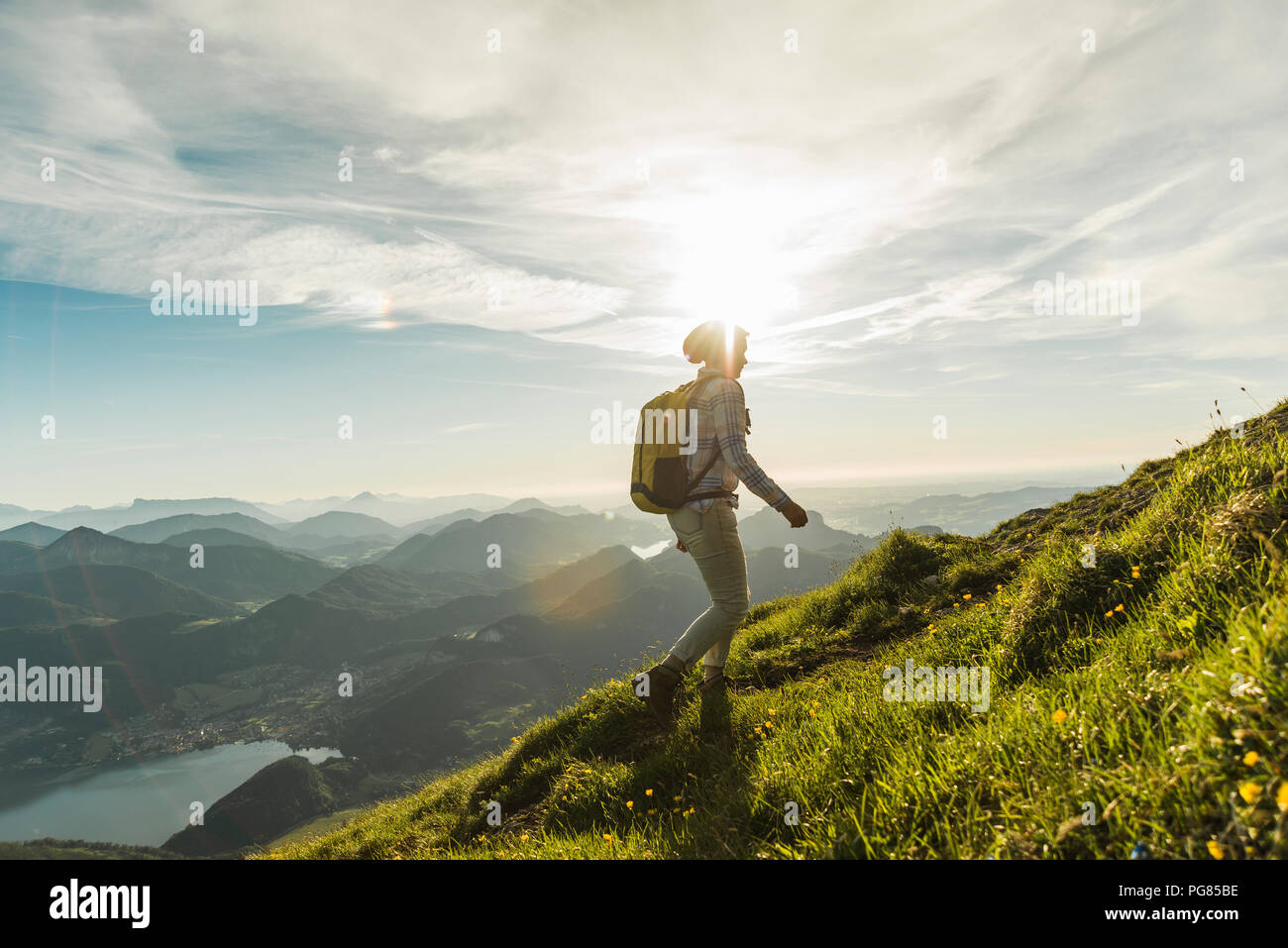 Woman walking alone in mountains hi-res stock photography and images ...
