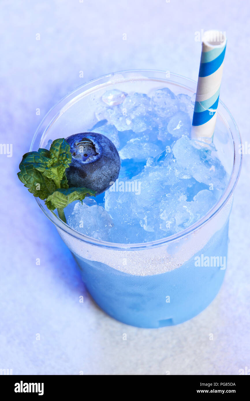 Plastic cup of blueberry slush Stock Photo - Alamy