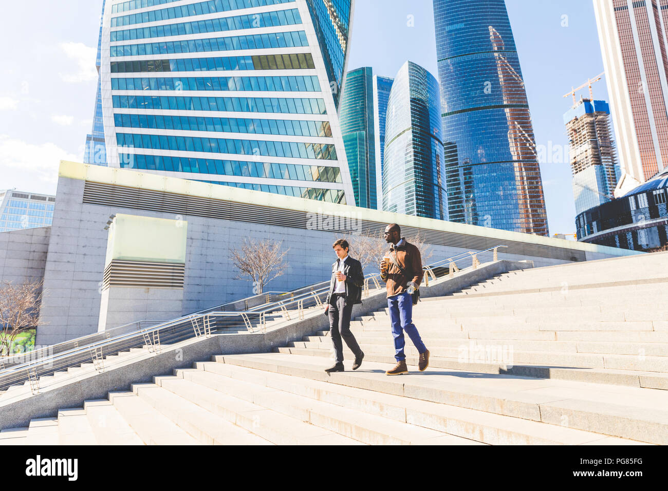 Two businessmen coffee to go city hi-res stock photography and images ...