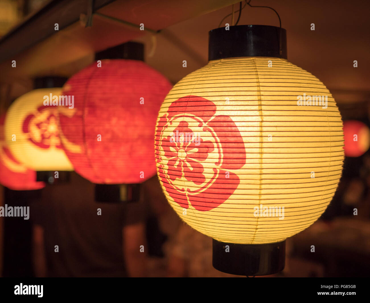 The glow of Japanese paper lanterns (with the cucumber crest of Yasaka ...
