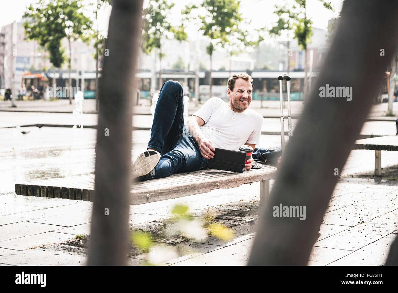 Man lying on bench hi-res stock photography and images - Alamy