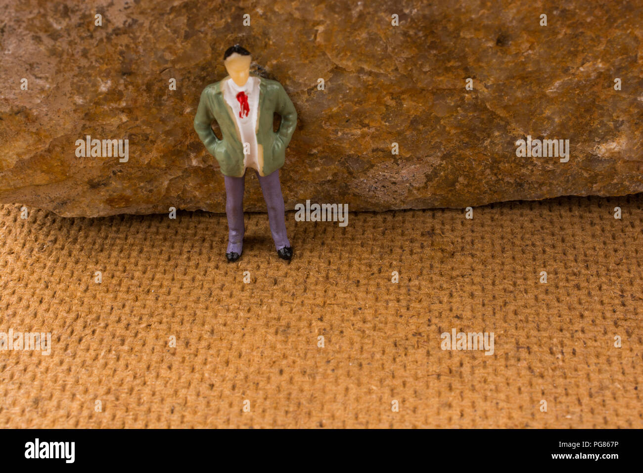 Human figure on rock on a white background Stock Photo - Alamy