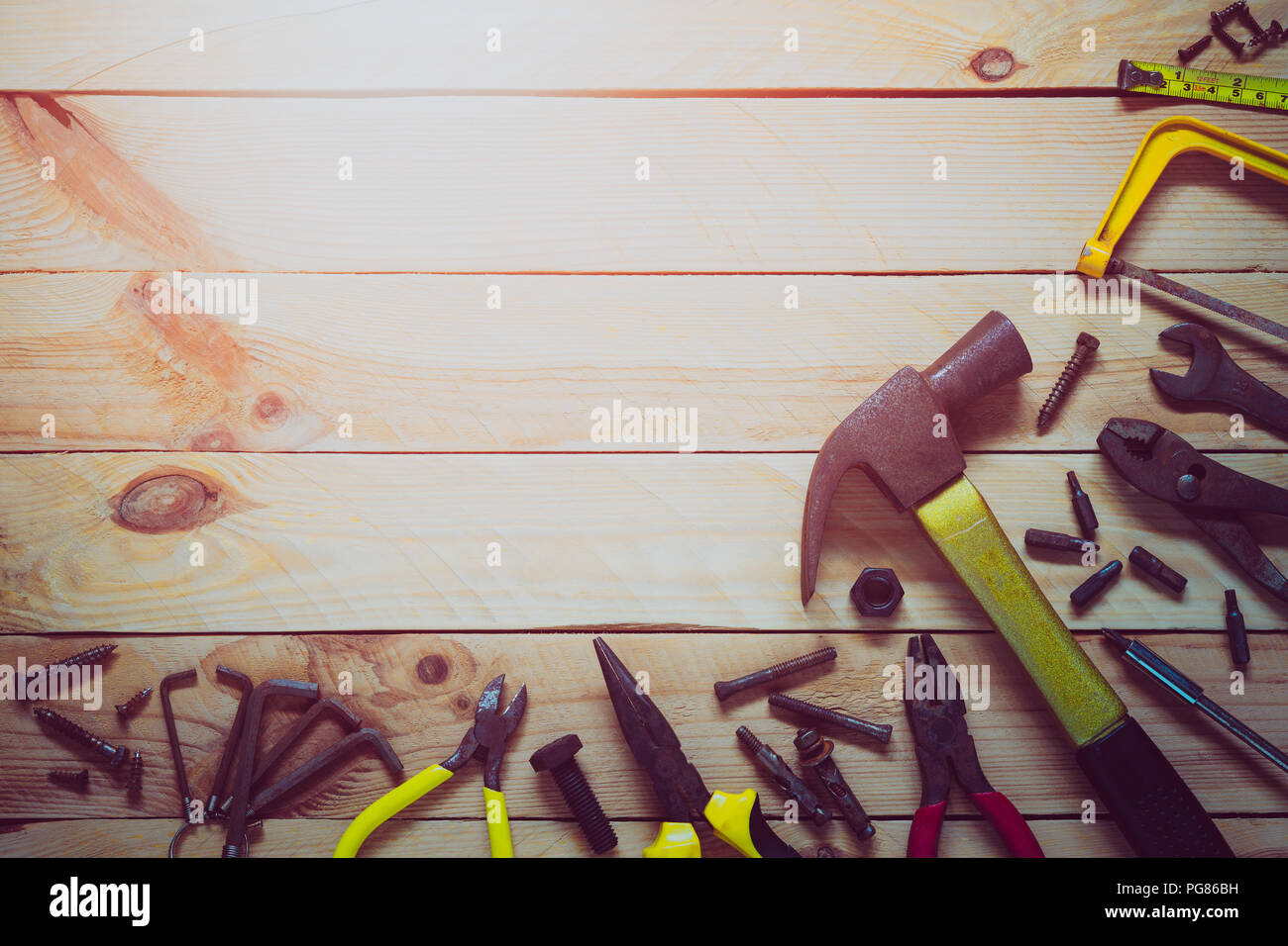 Top view of variety rusty handy tools on wooden background with copy ...
