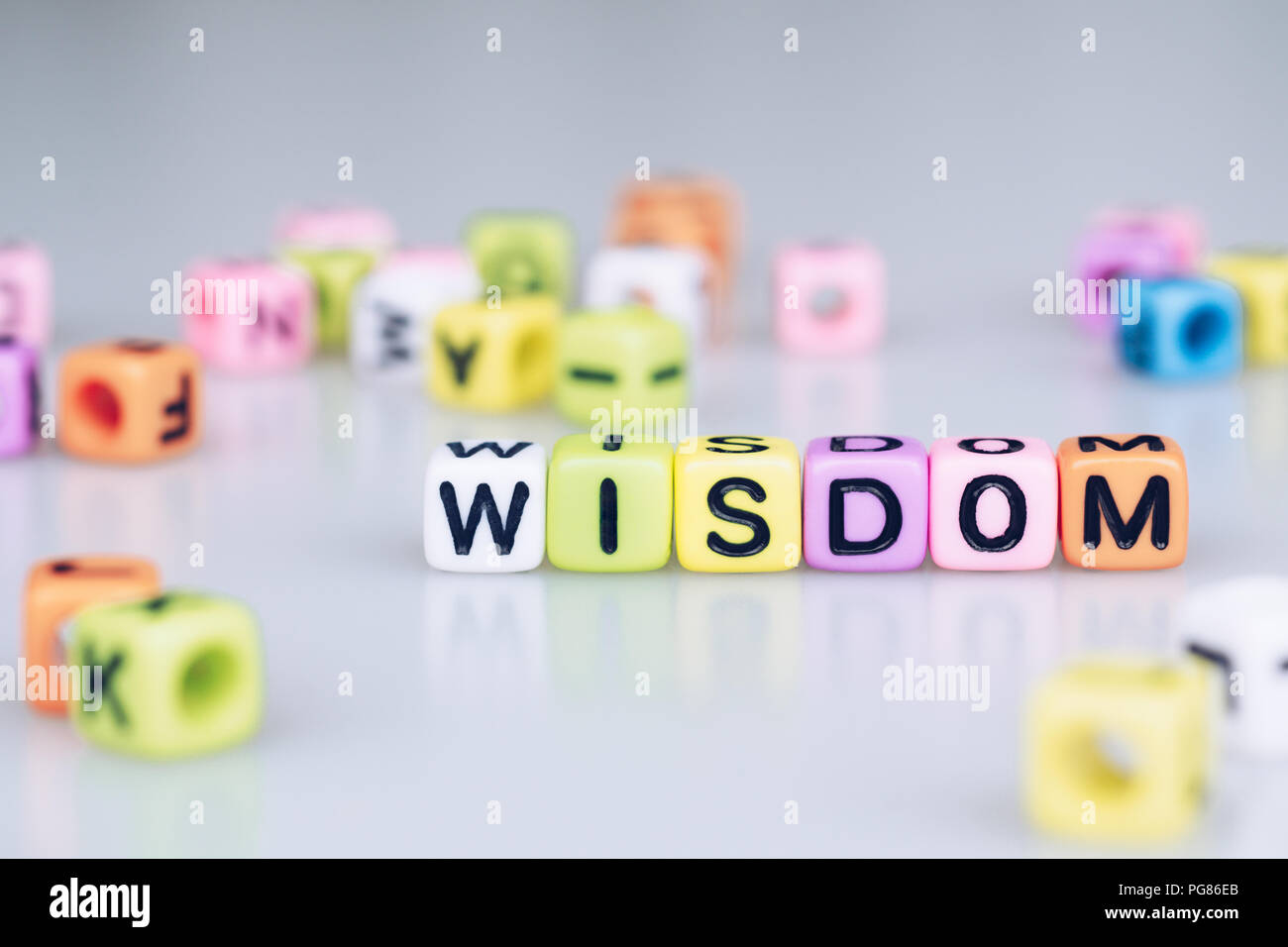 Wisdom word text written on colorful cube with bokeh cube word block ...