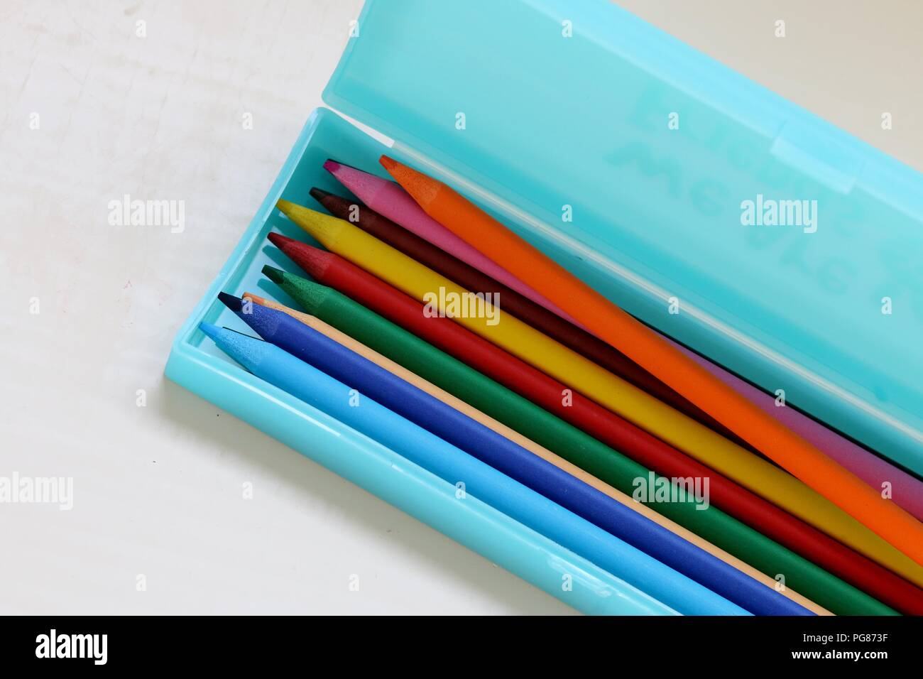 Colored pencils in a light blue pencil case Stock Photo - Alamy