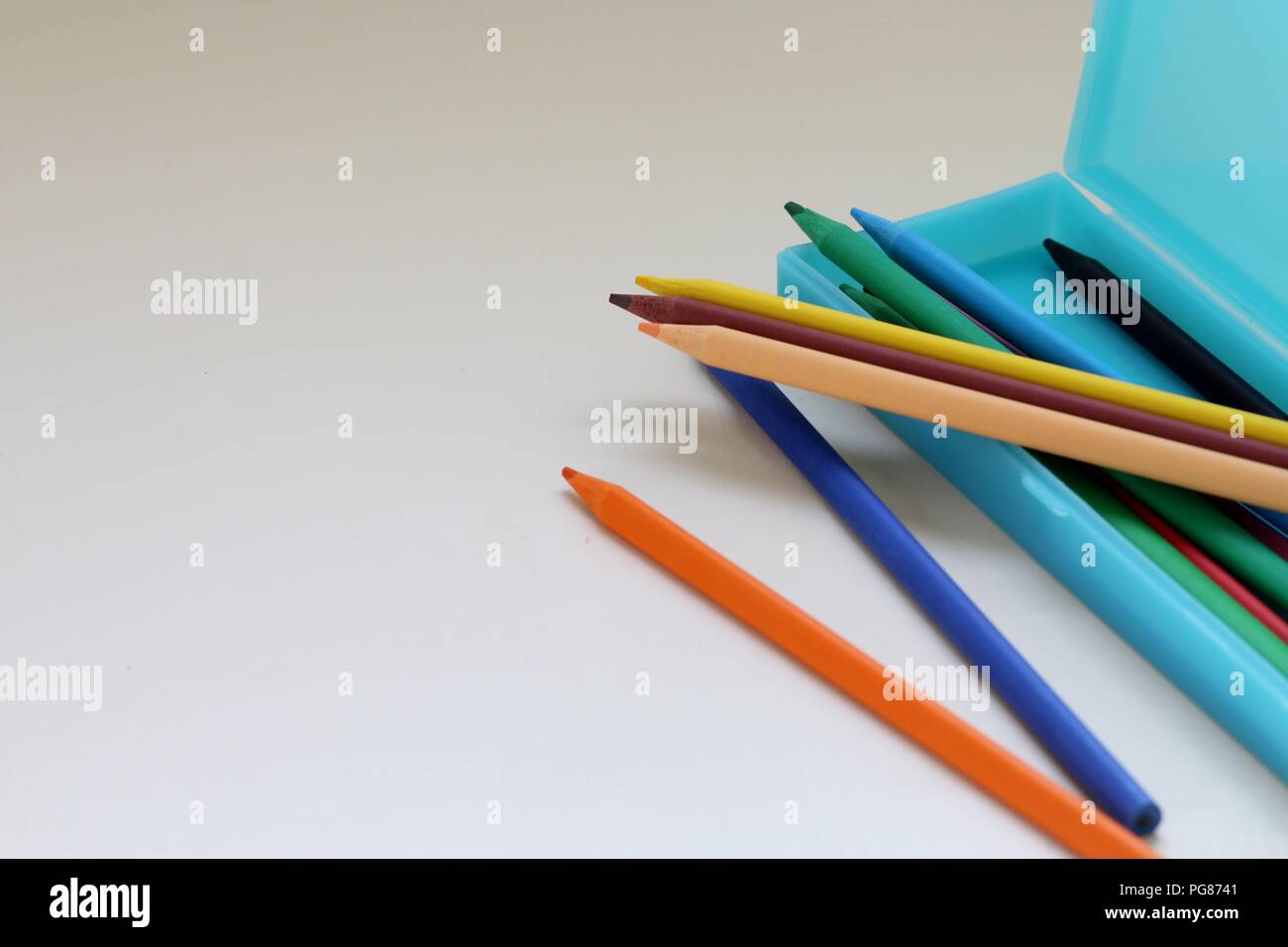 Colored pencils in a light blue pencil case Stock Photo - Alamy