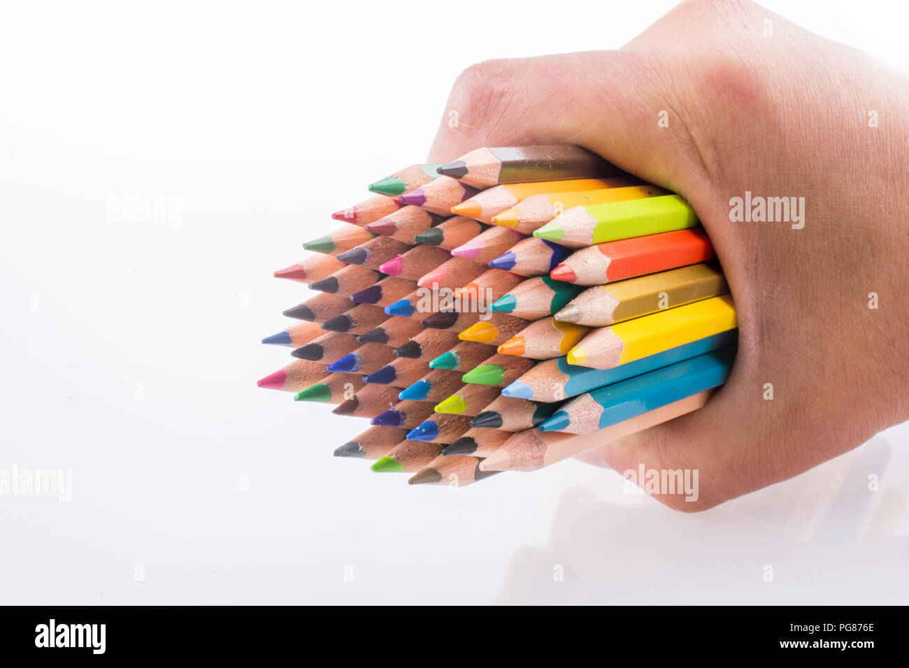 Hand holding Color pencils on a white background Stock Photo - Alamy