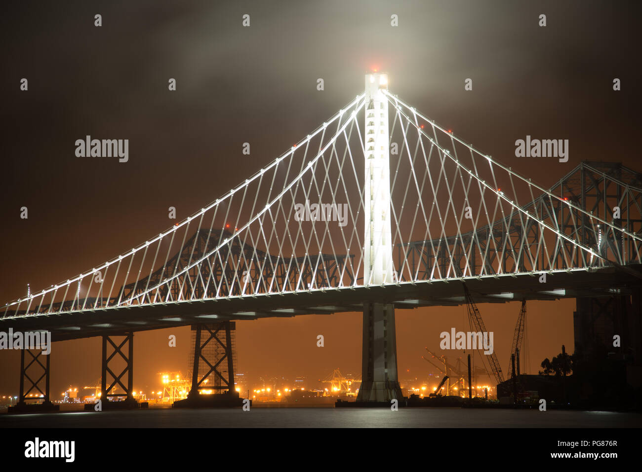 View of the Bay Bridge lit up at night, San Francisco, North Beach ...