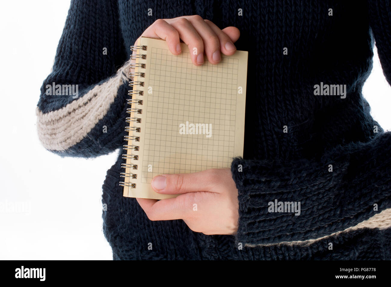 Hand holding a notebook on a white background Stock Photo - Alamy