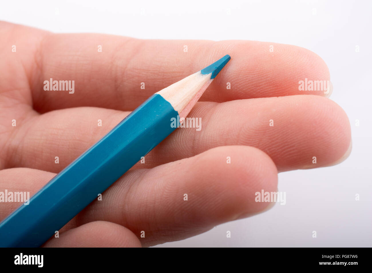 Hand holding color pencil on a white background Stock Photo - Alamy