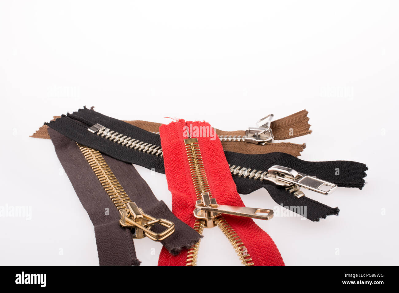 Color zippers on a white background Stock Photo - Alamy