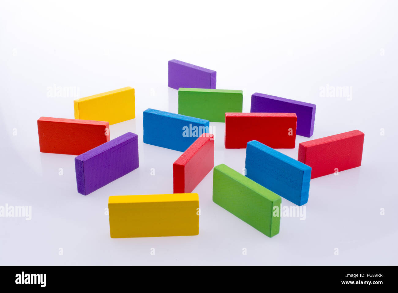 Color dominoes on a white background Stock Photo - Alamy