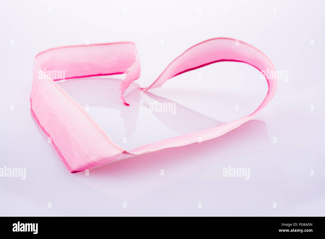Heart made of ribbon on a white background Stock Photo - Alamy
