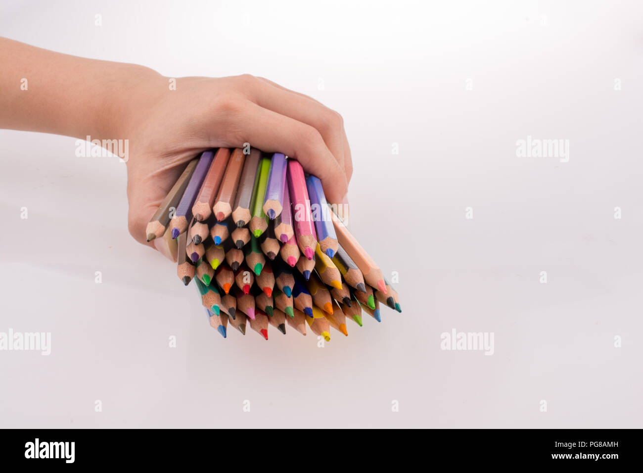Hand holding Color pencils on a white background Stock Photo - Alamy