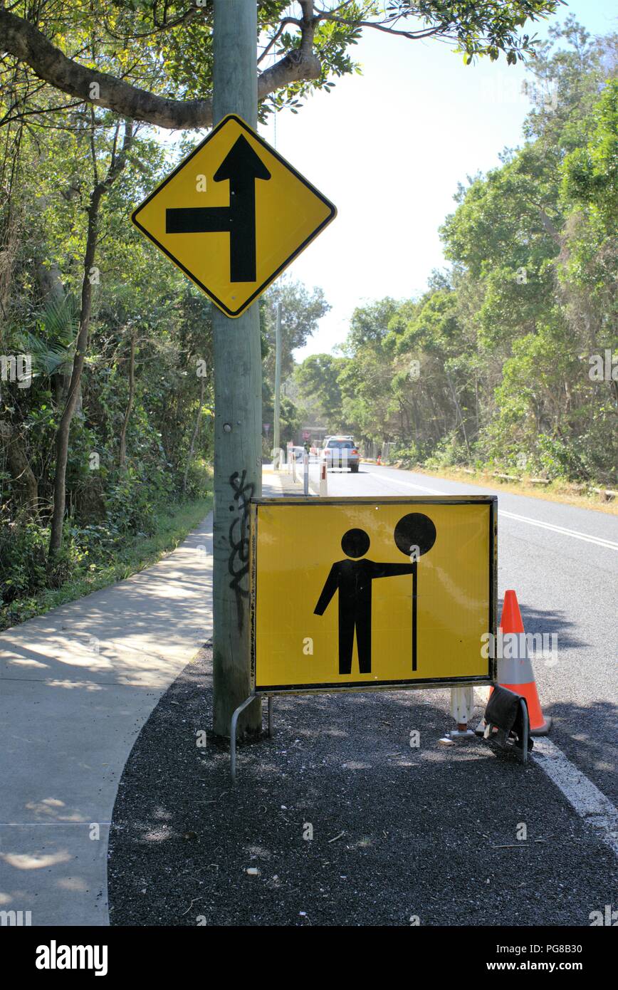 Slow down men work sign hi-res stock photography and images - Alamy