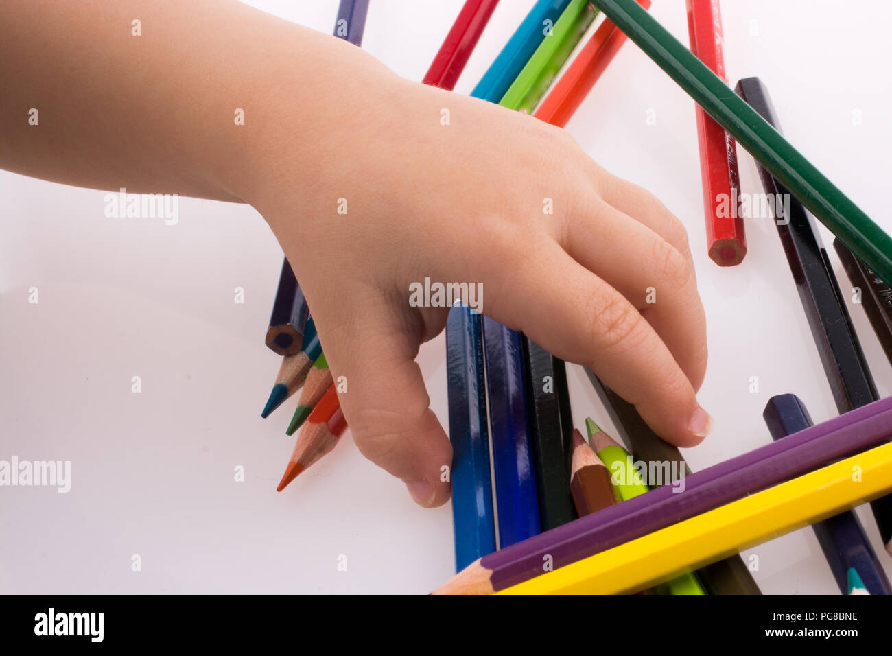 Hand holding Color pencils on a white background Stock Photo - Alamy