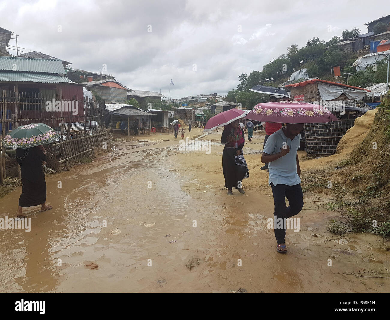 13 August 2018, Bangladesh, Cox's Bazar: Rohingya refugees walk through ...
