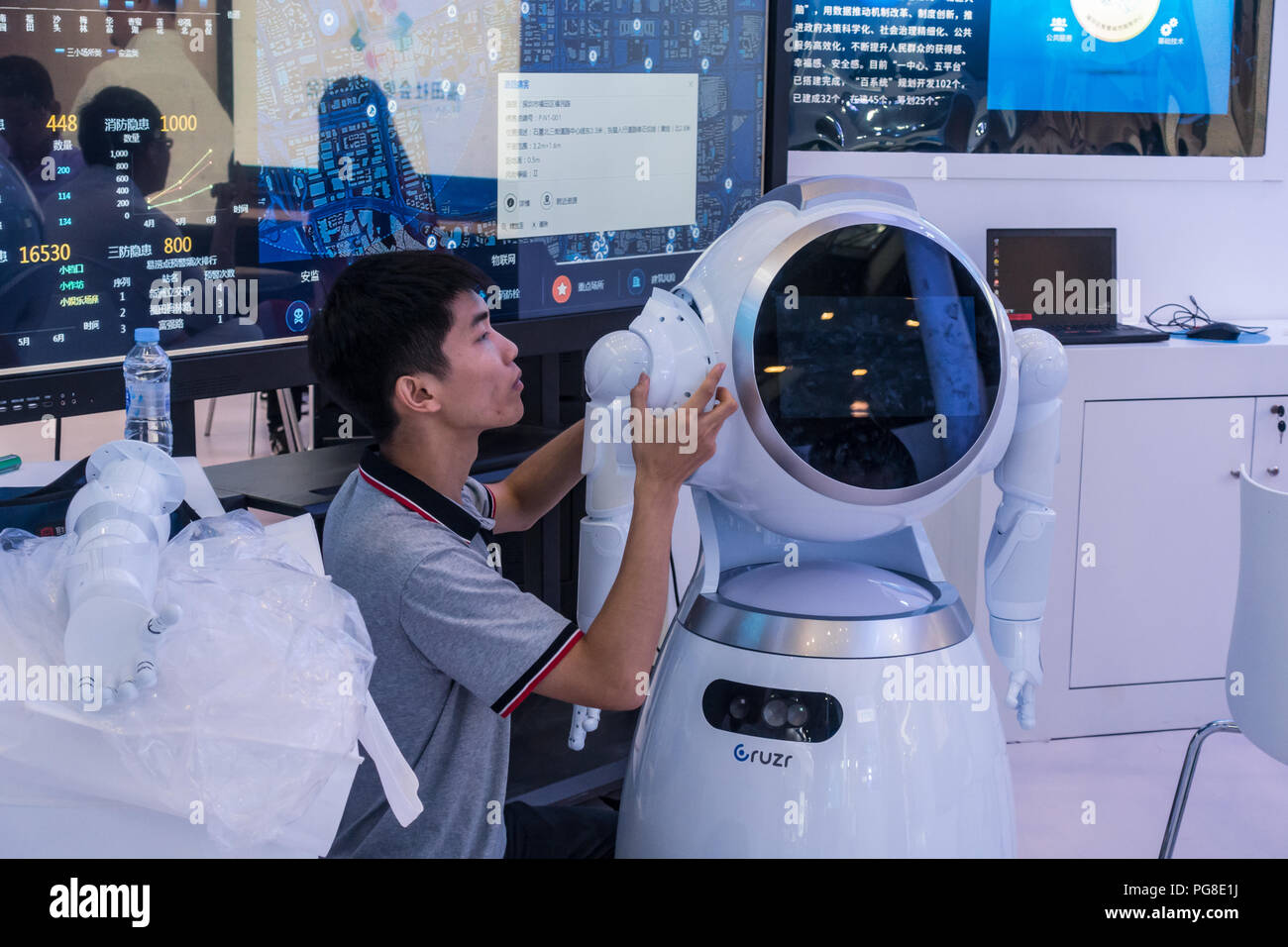 Robot repair and assembly in China (man repairing robot Stock Photo - Alamy