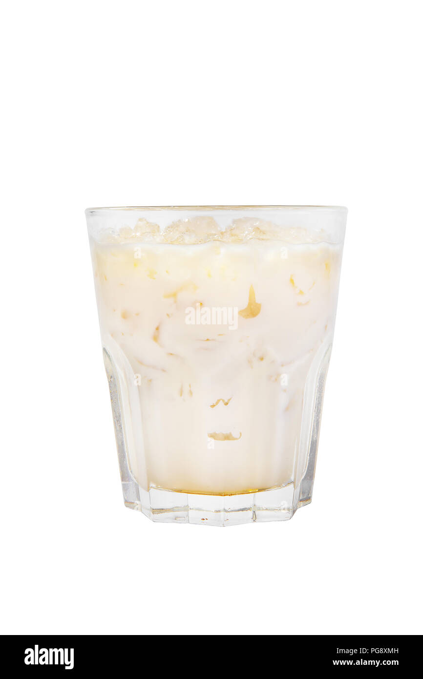 Single-color opaque creamy, milkshake in a low glass, with crushed ice ...