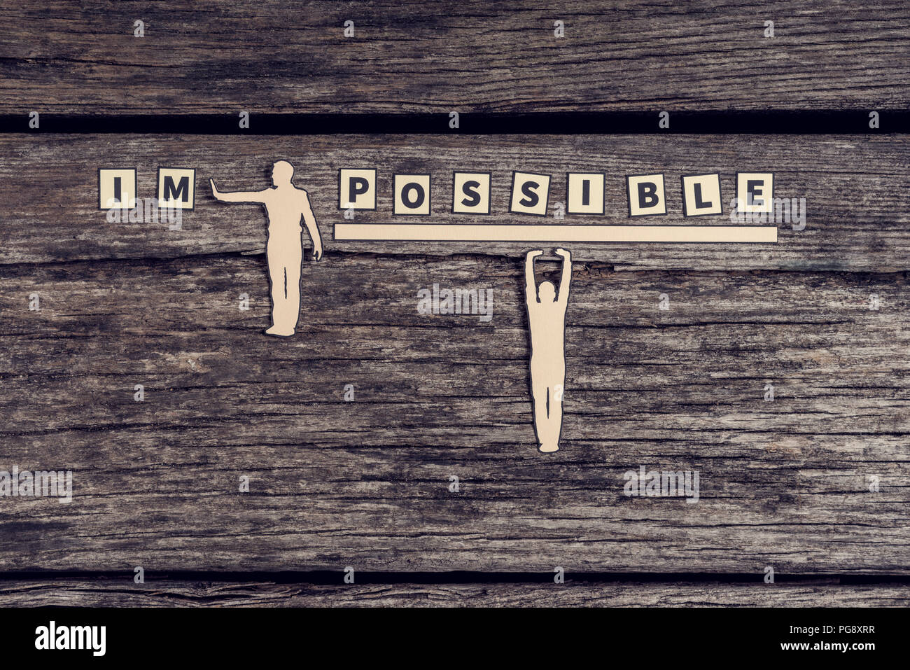 Impossible - Possible teamwork concept with two paper cut outs of men ...