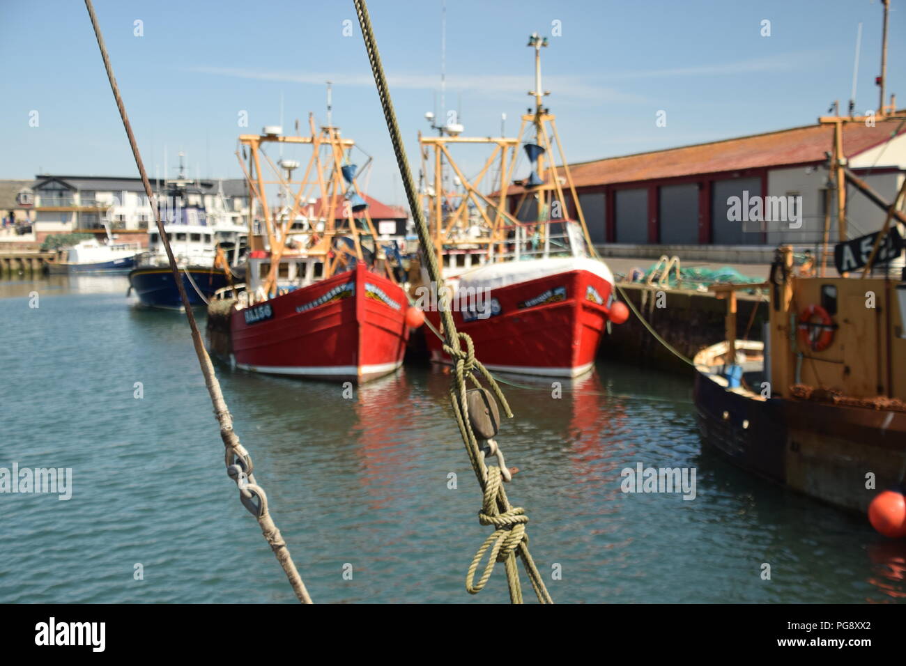 Red trawlers fishing boats in Arbroath harbour Scotland Stock Photo - Alamy Red trawlers fishing boats in Arbroath harbour Scotland Stock Photo - Alamy
