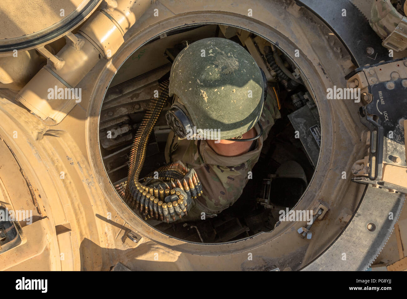 An armor crewman assigned to Task Force Raider load 7.62mm rounds onto ...