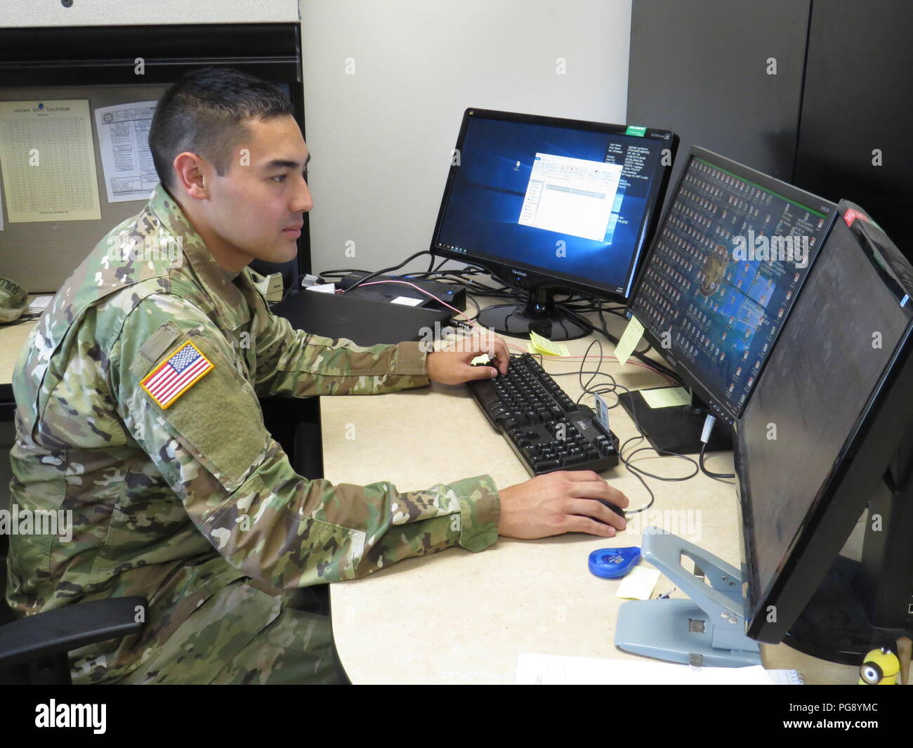 US Army Reserve 1st Lt. Michael Pernell reviews personnel files during ...