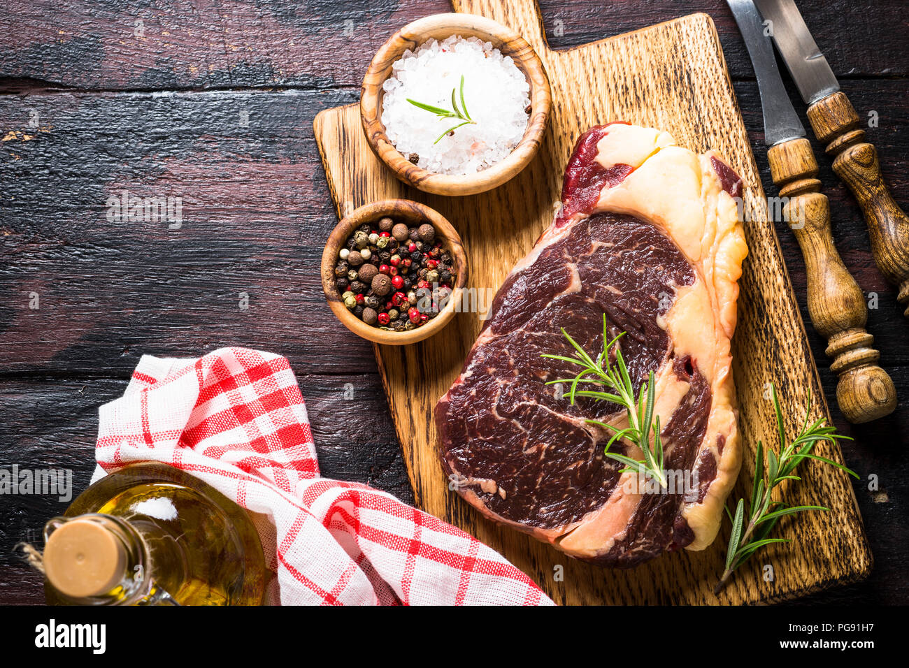 Beef steak ribeye with herbs and spices top view Stock Photo - Alamy
