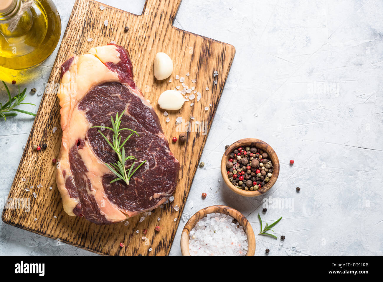 Beef steak ribeye with herbs and spices top view Stock Photo - Alamy