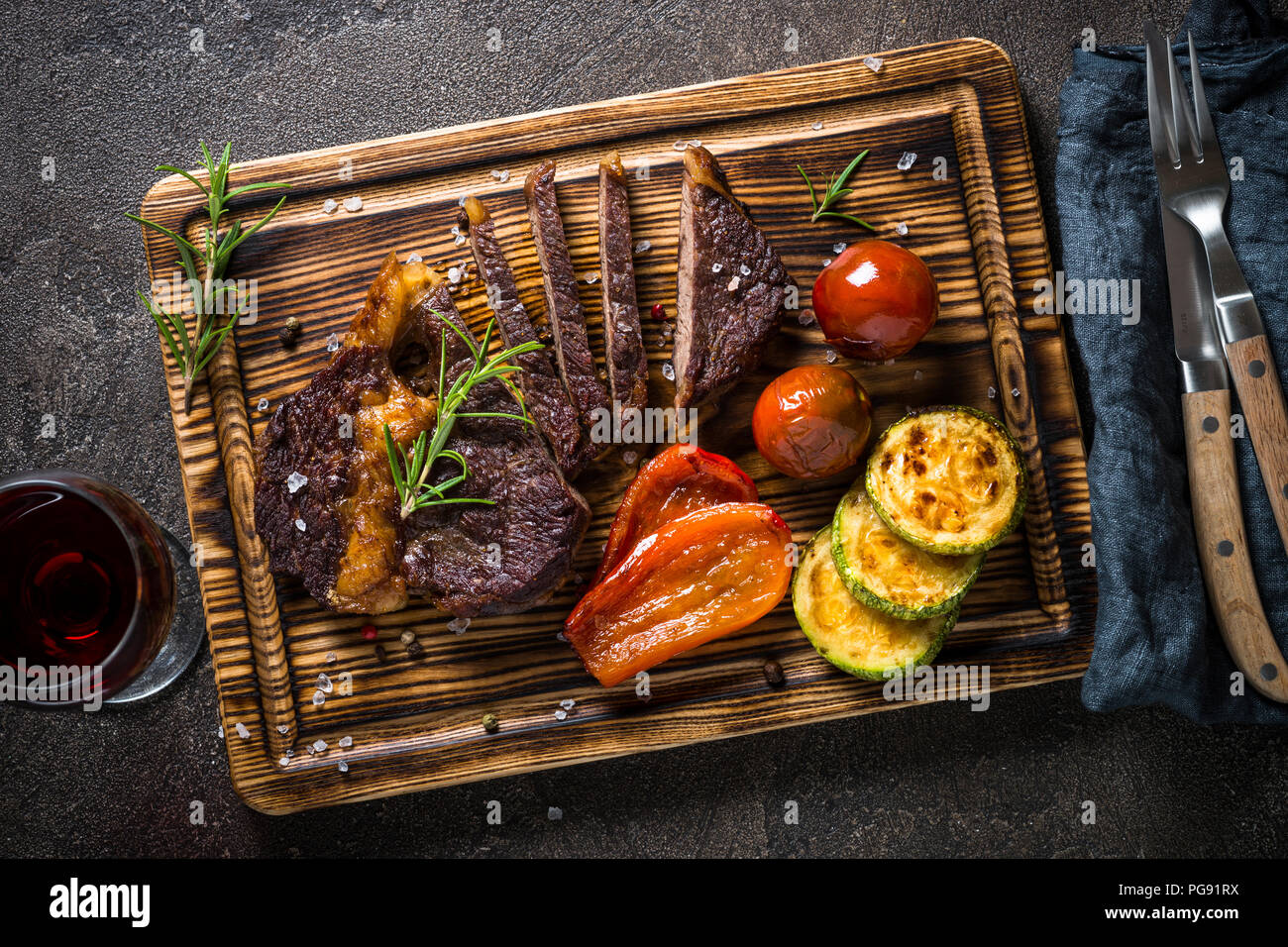 Grilled beef steak with vegetables top view Stock Photo - Alamy