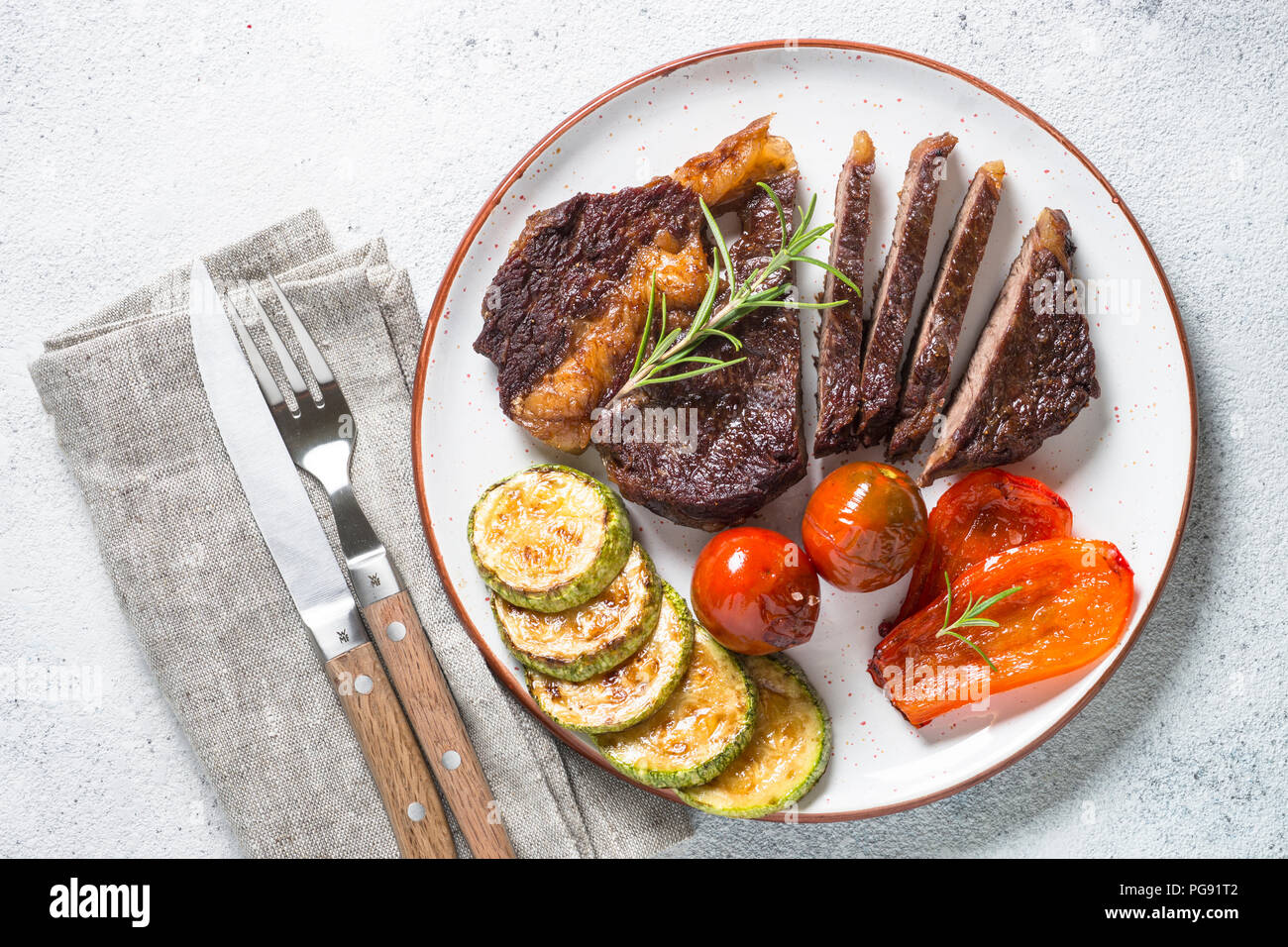 Grilled beef steak with vegetables top view Stock Photo - Alamy