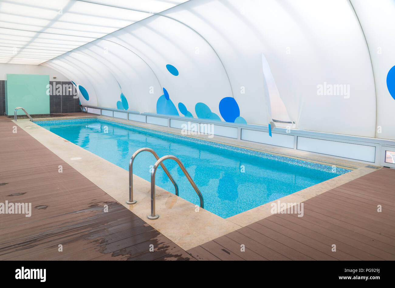 Wide angle view of swimming pool with a roof Stock Photo - Alamy