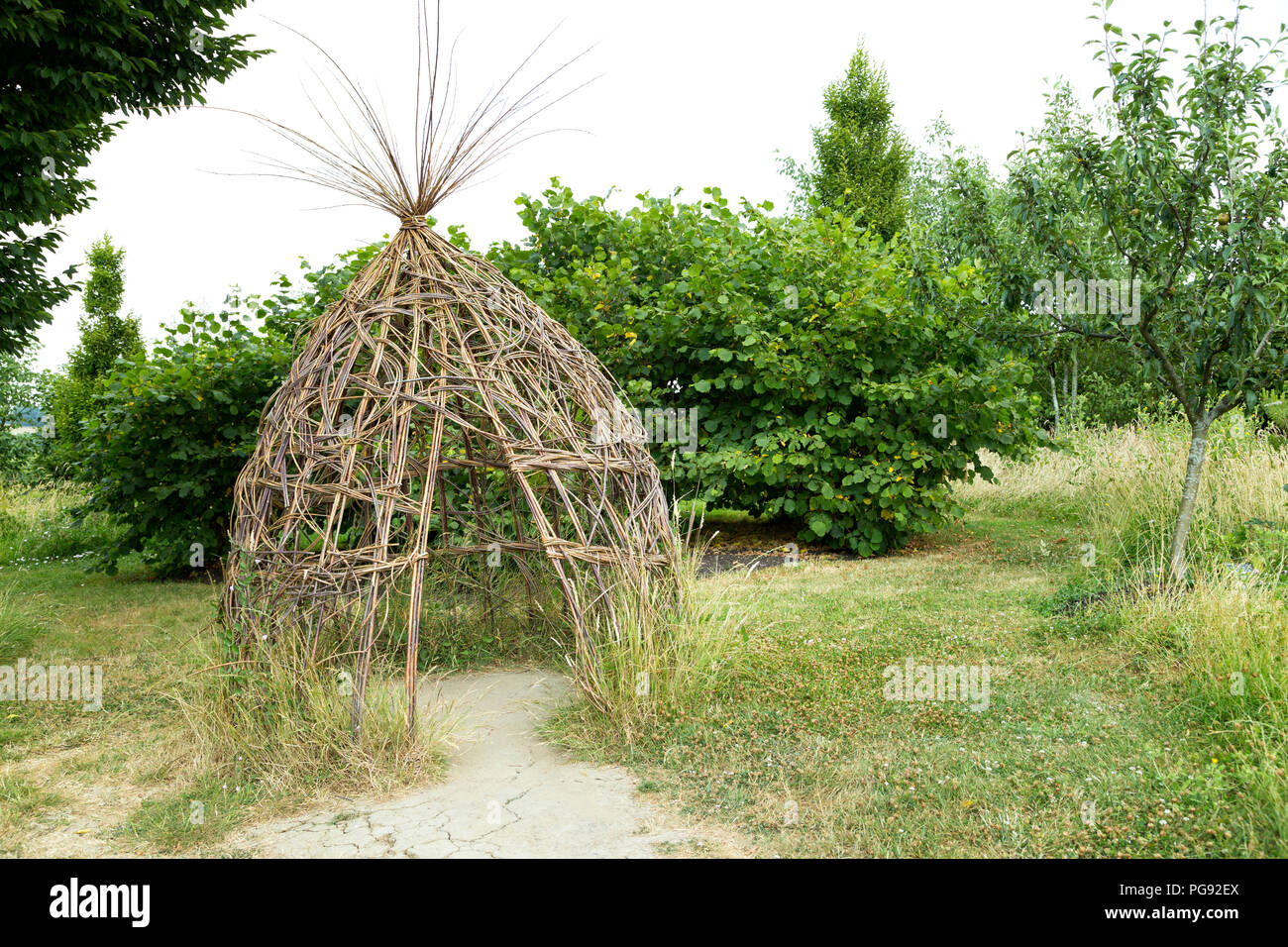 Decorative wicker hut hand crafted in Hyde Hall Garden, Essex, UK Stock ...