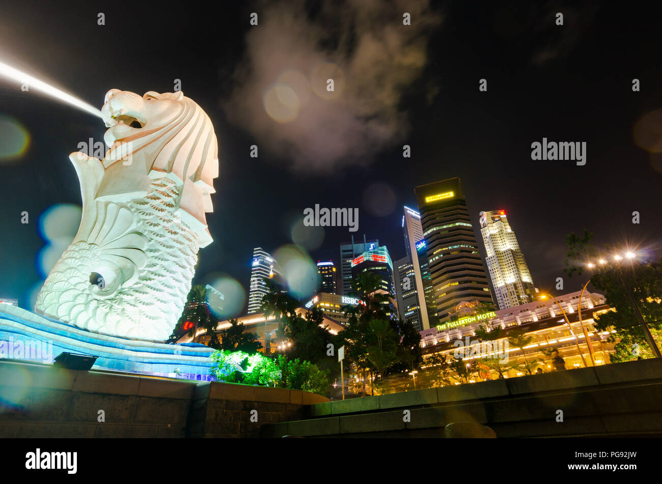 SINGAPORE - 17 Jul 2014: the iconic Merlion spits water in front of the ...
