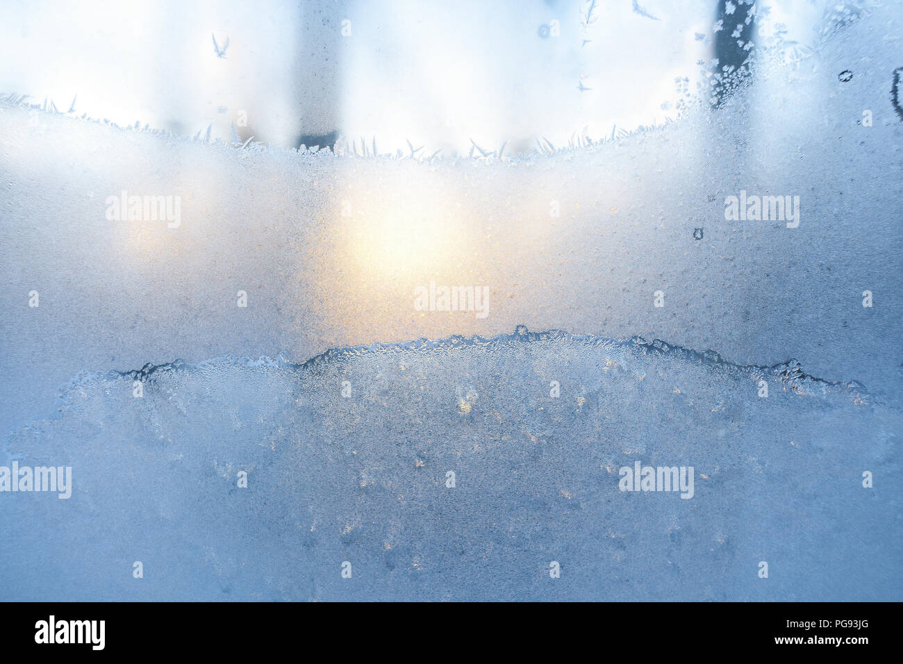 Frozen winter window with natural icy pattern and morning sun Stock ...