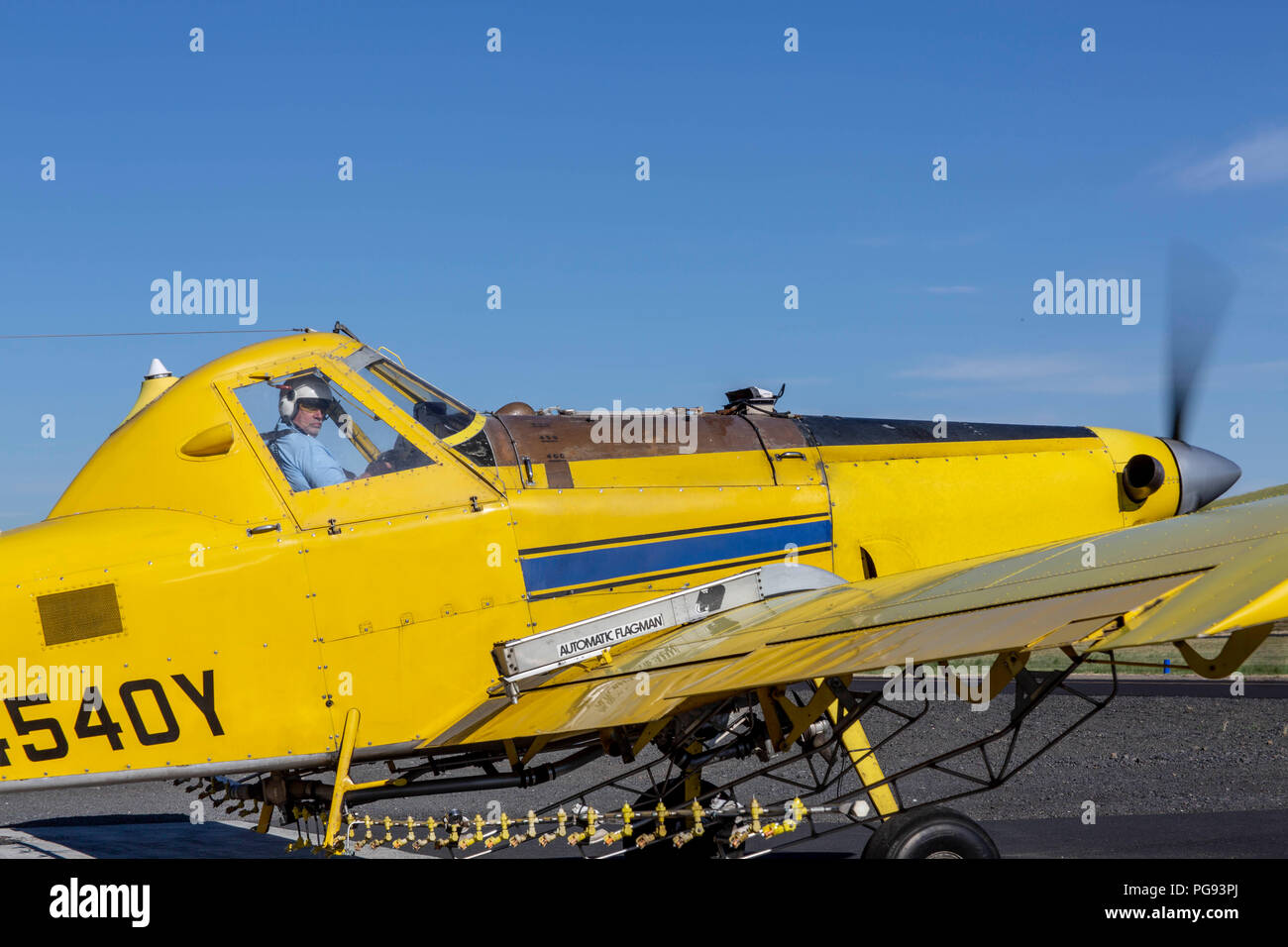 Yellow crop duster plane in a small airport in Pullman Washington Stock ...