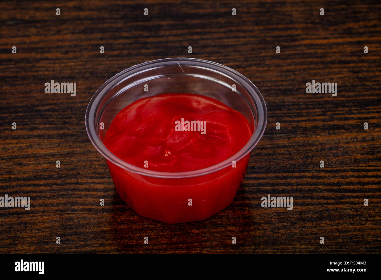 Ketchup sauce portion over wooden Stock Photo - Alamy