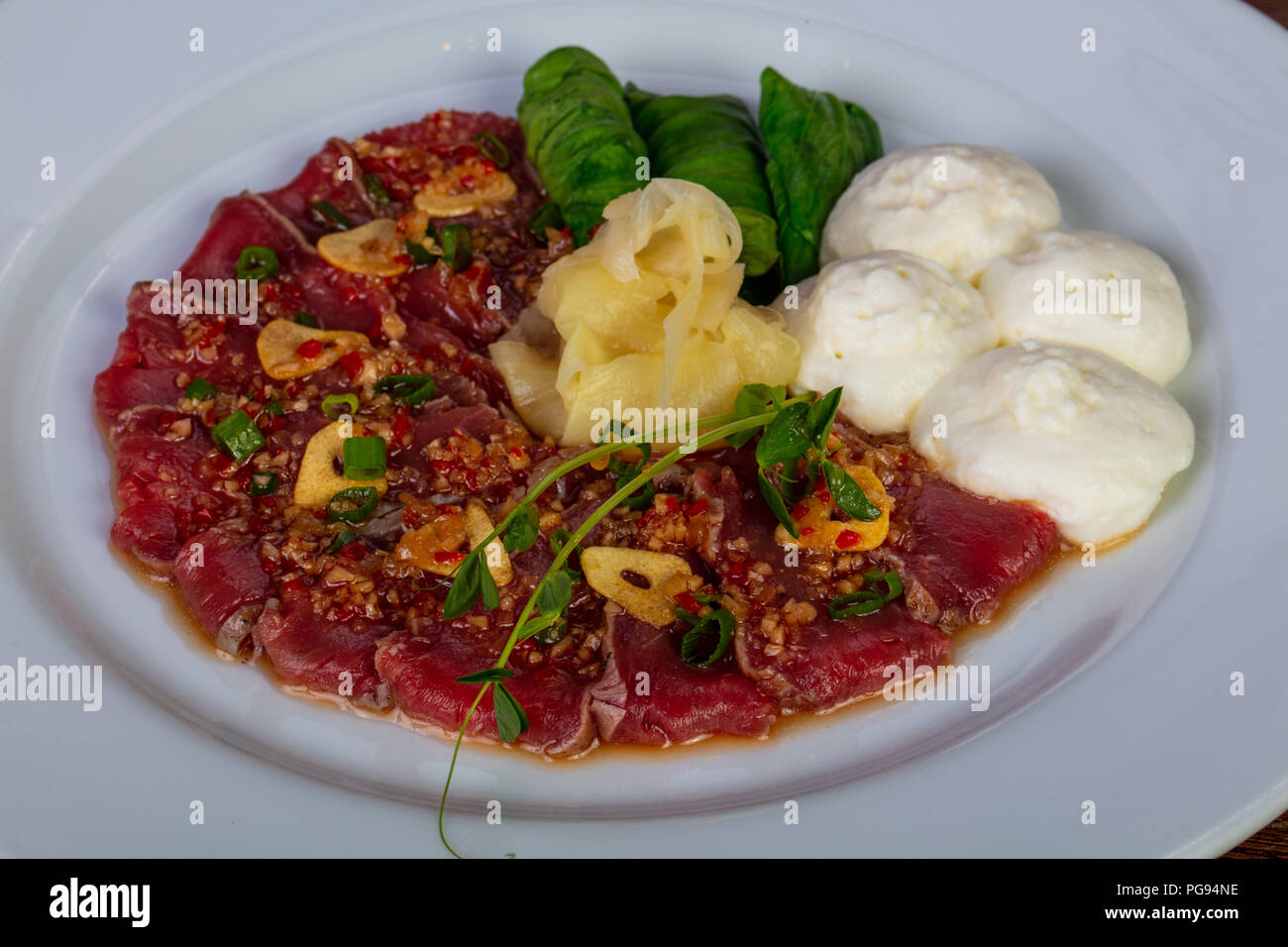 Raw Japanese young Beef carpaccio Stock Photo - Alamy