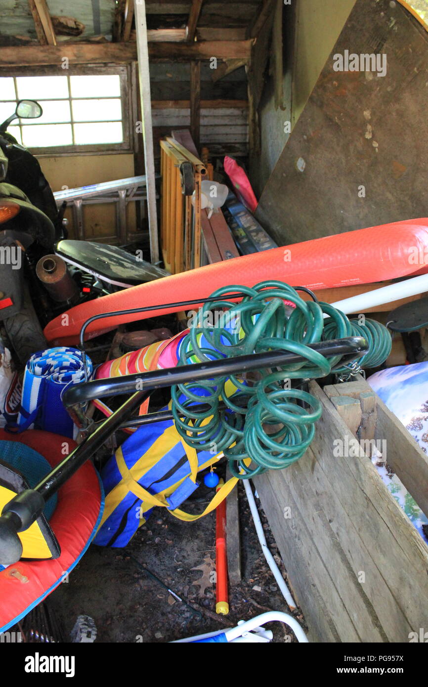 Weathered old storage shed full of storage items, gear, equipment ...