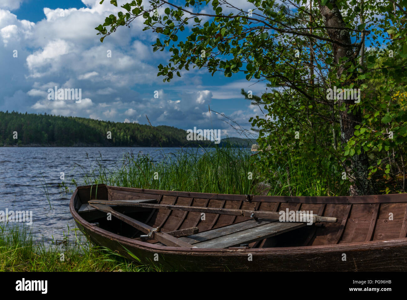 Old wooden rowing boat on the shore of the Saimaa lake in Finland - 9 ...