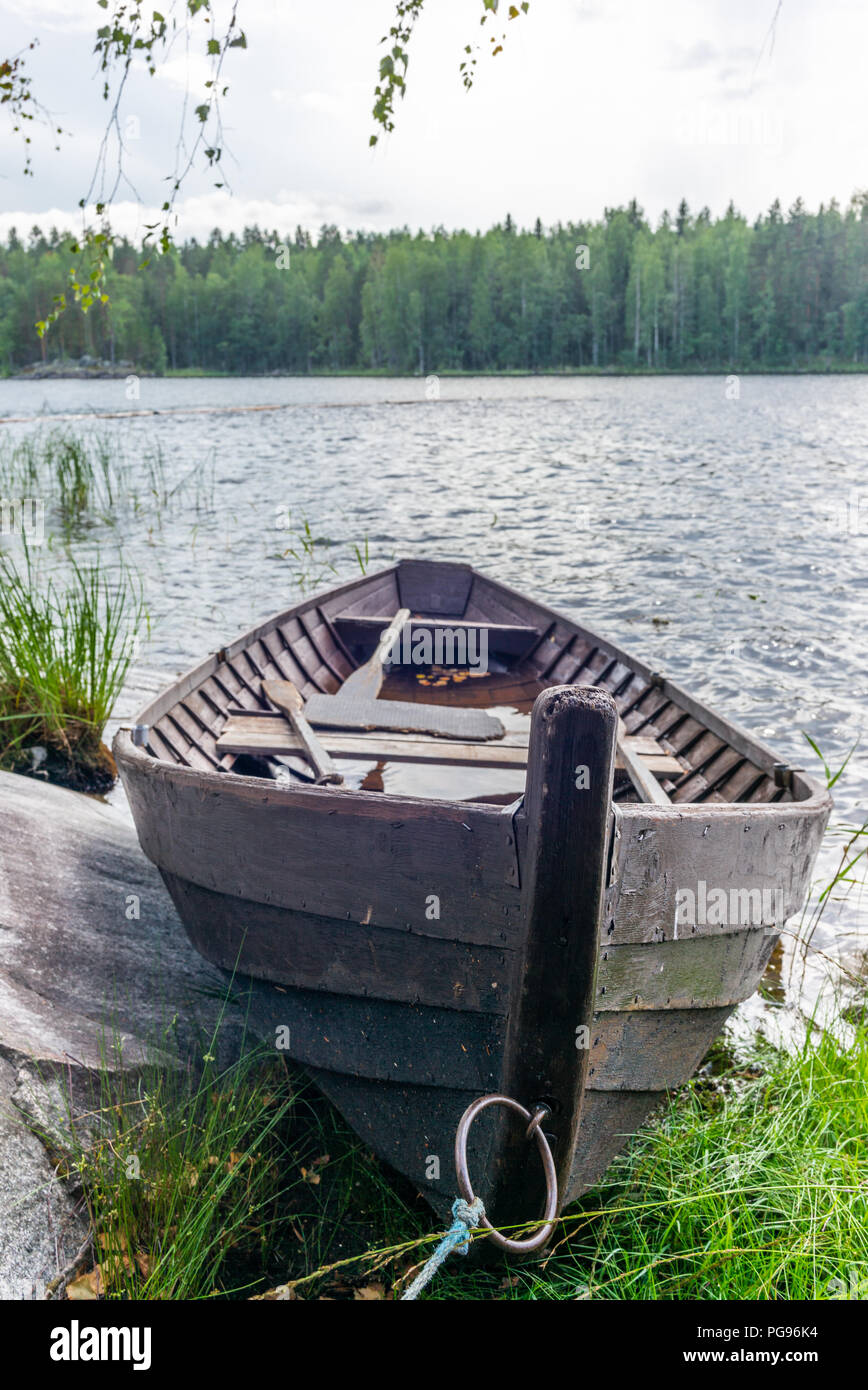 Old wooden rowing boat on the shore of the Saimaa lake in Finland - 17 ...