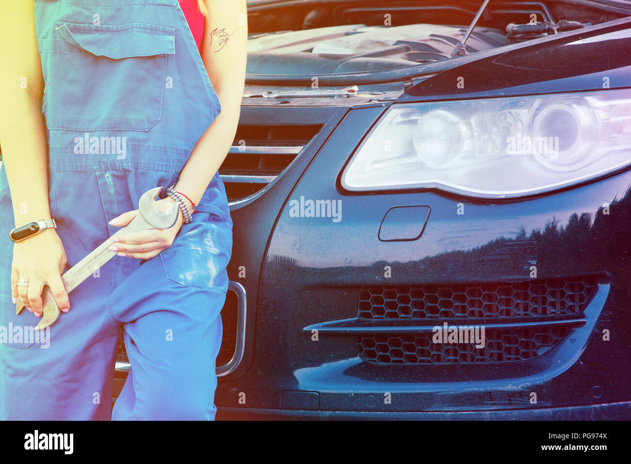 Wait for roadside assistance. Portrait of a young woman standing next ...