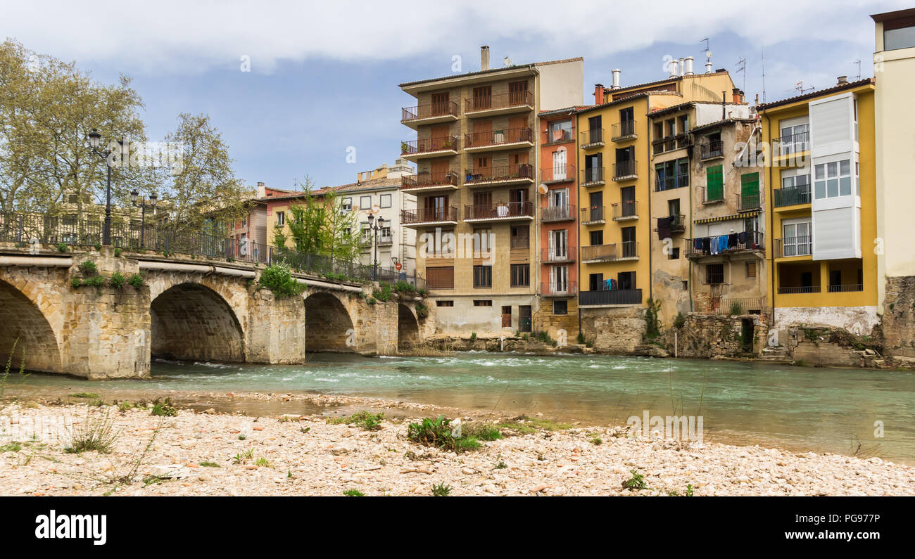 Colorful houses and bridge at the Ega river in Estella, Spain Stock ...